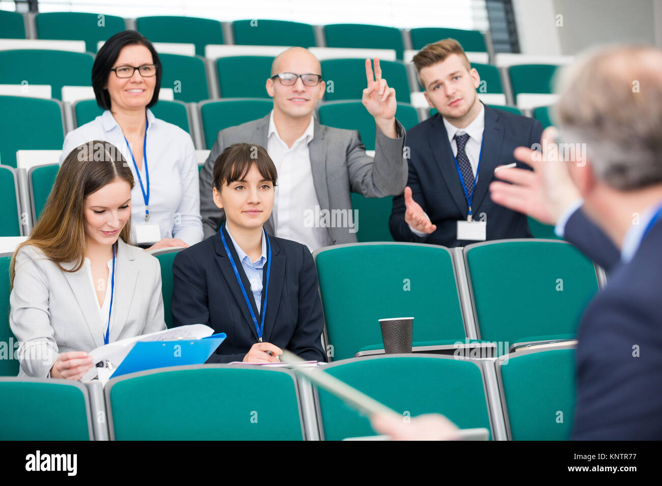 Businessman raising hand hi-res stock photography and images - Alamy