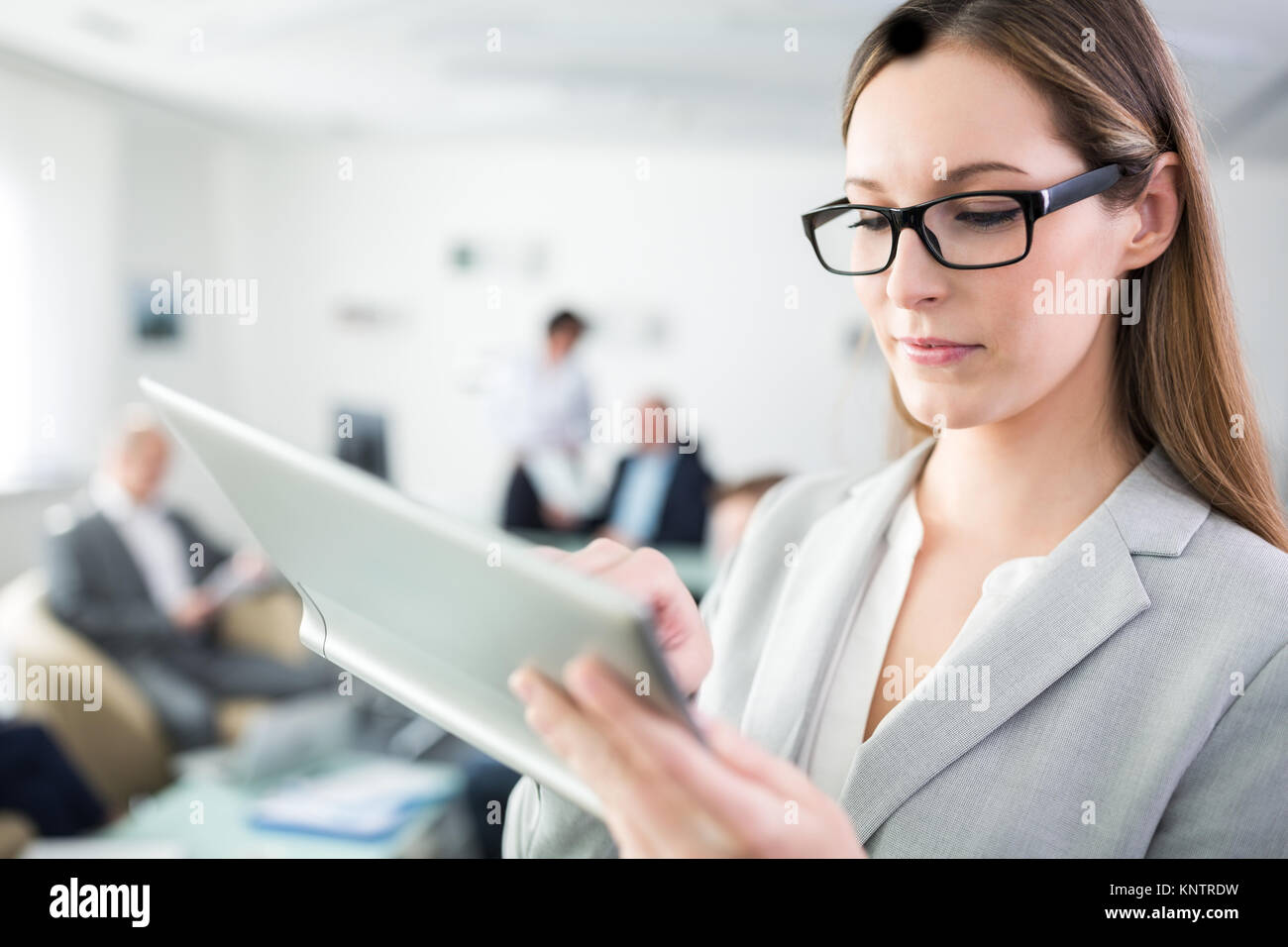 Businesswoman using digital tablet in meeting room at office Stock ...