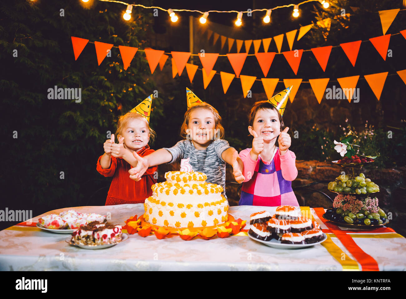Children eating birthday cake hands hi-res stock photography and images ...