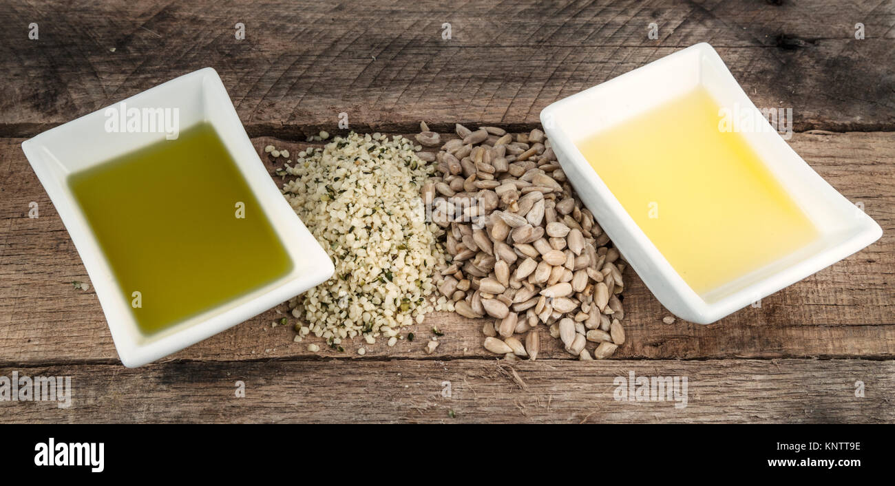 Hemp and Sunflower oils and grains Stock Photo - Alamy