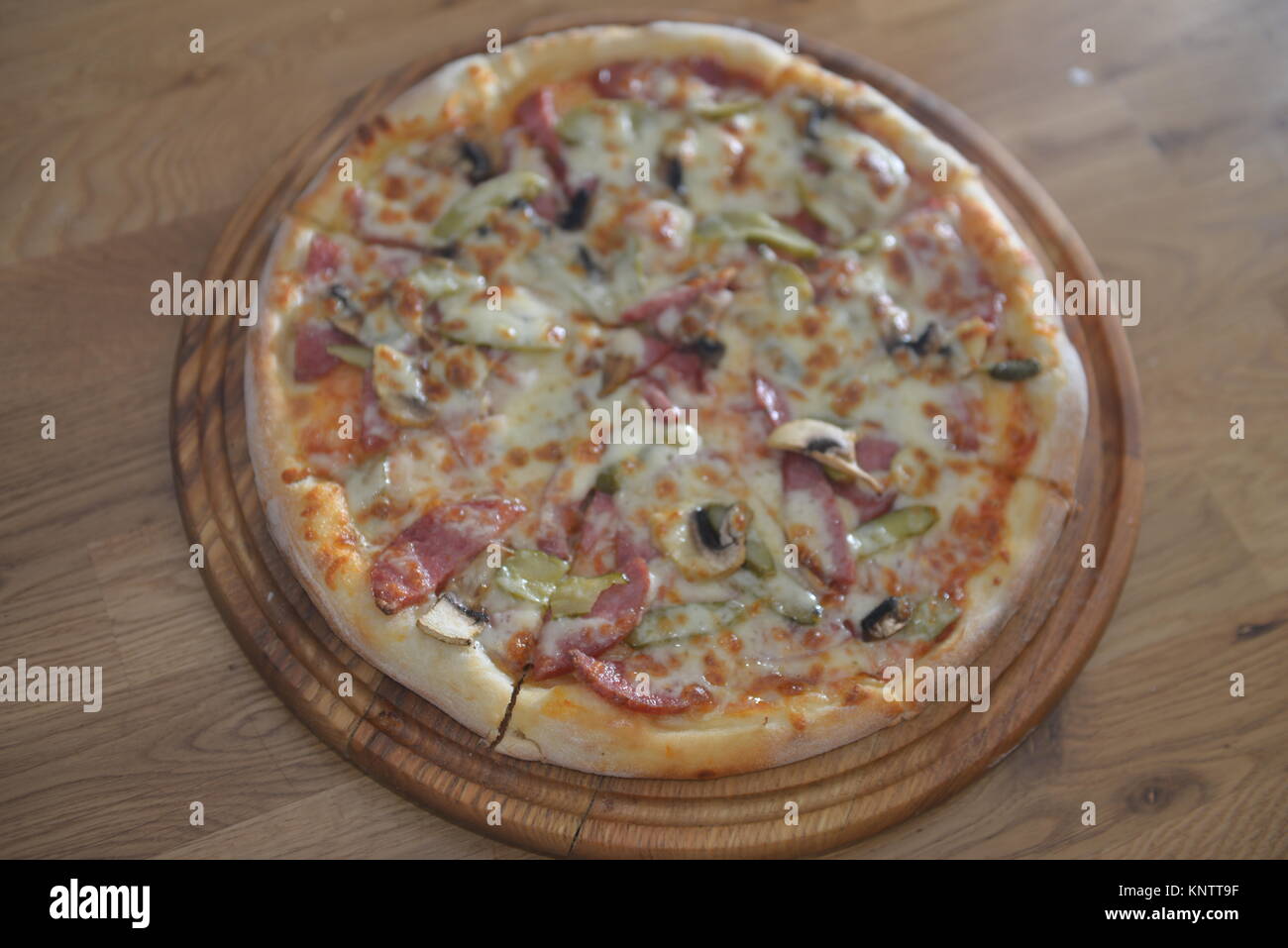 Hot Homemade Pepperoni Pizza Ready to Eat. Pizza on a wooden plate on ...