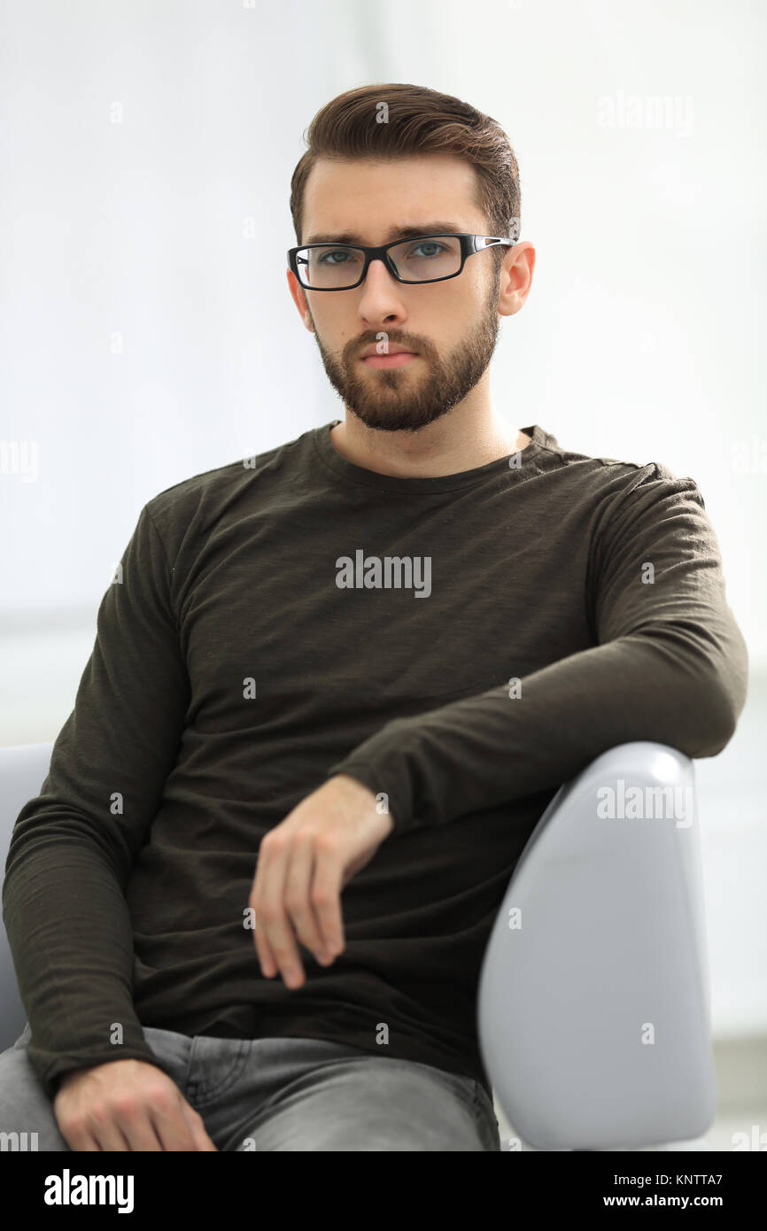 Pleasant guy is resting on sofa Stock Photo - Alamy