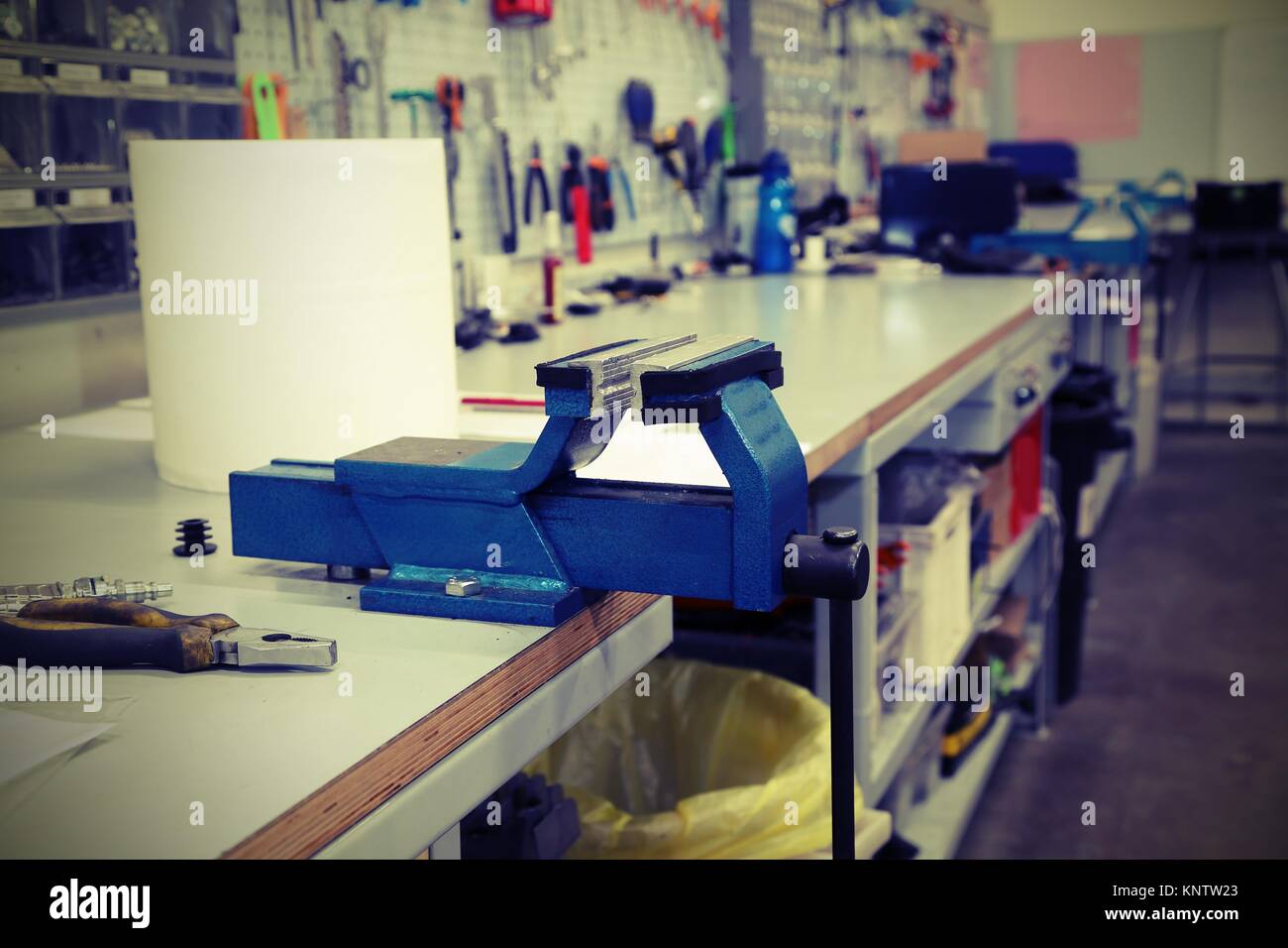 long workbench in a mechanical workshop for repairs with vintage effect ...
