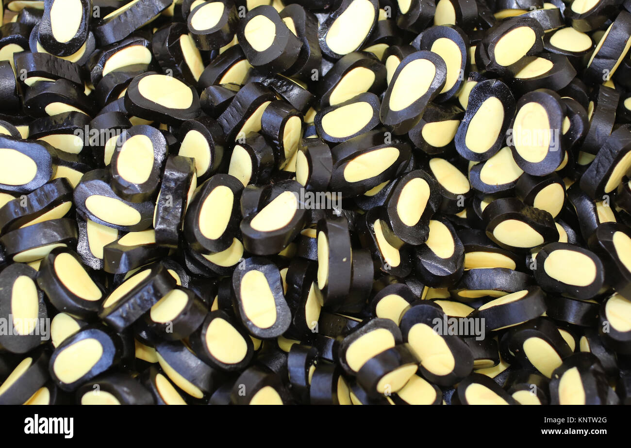 background of sweet licorice pieces filled with lemon taste Stock Photo ...