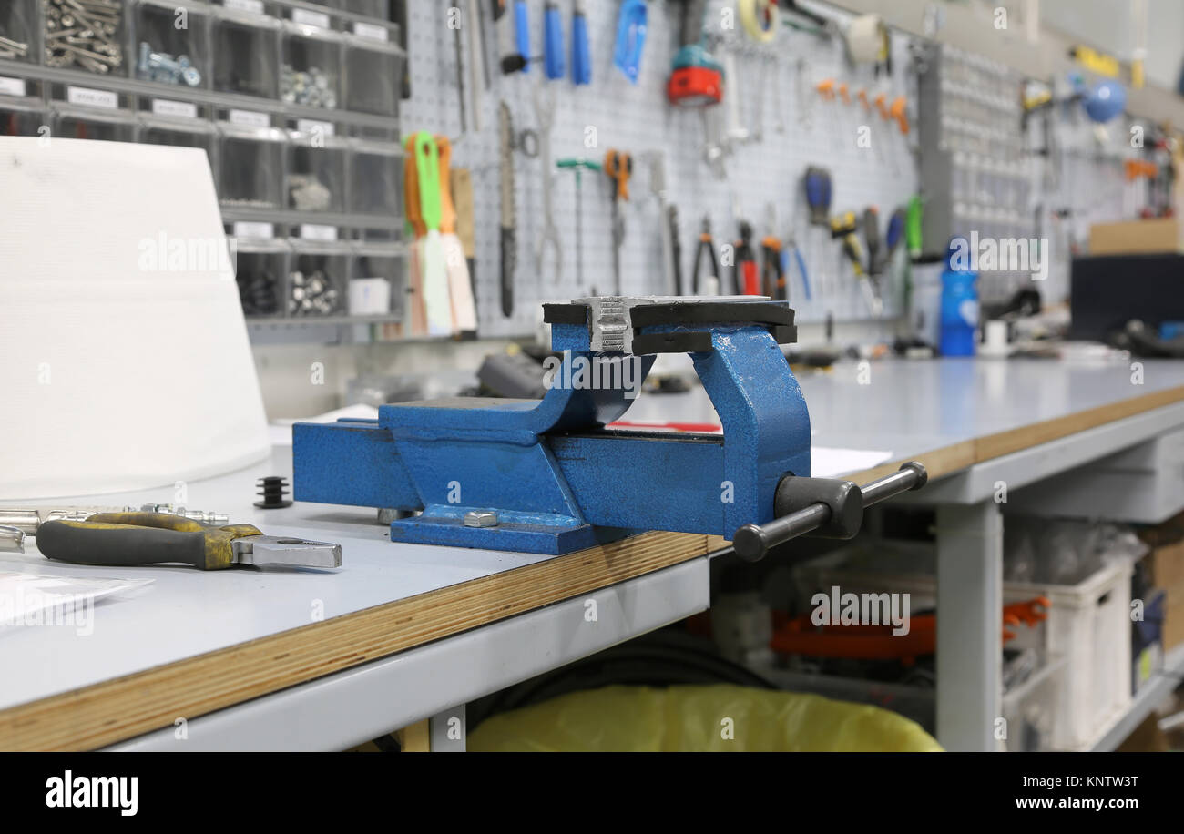 long workbench in a mechanical workshop for repairs with blue heavy ...