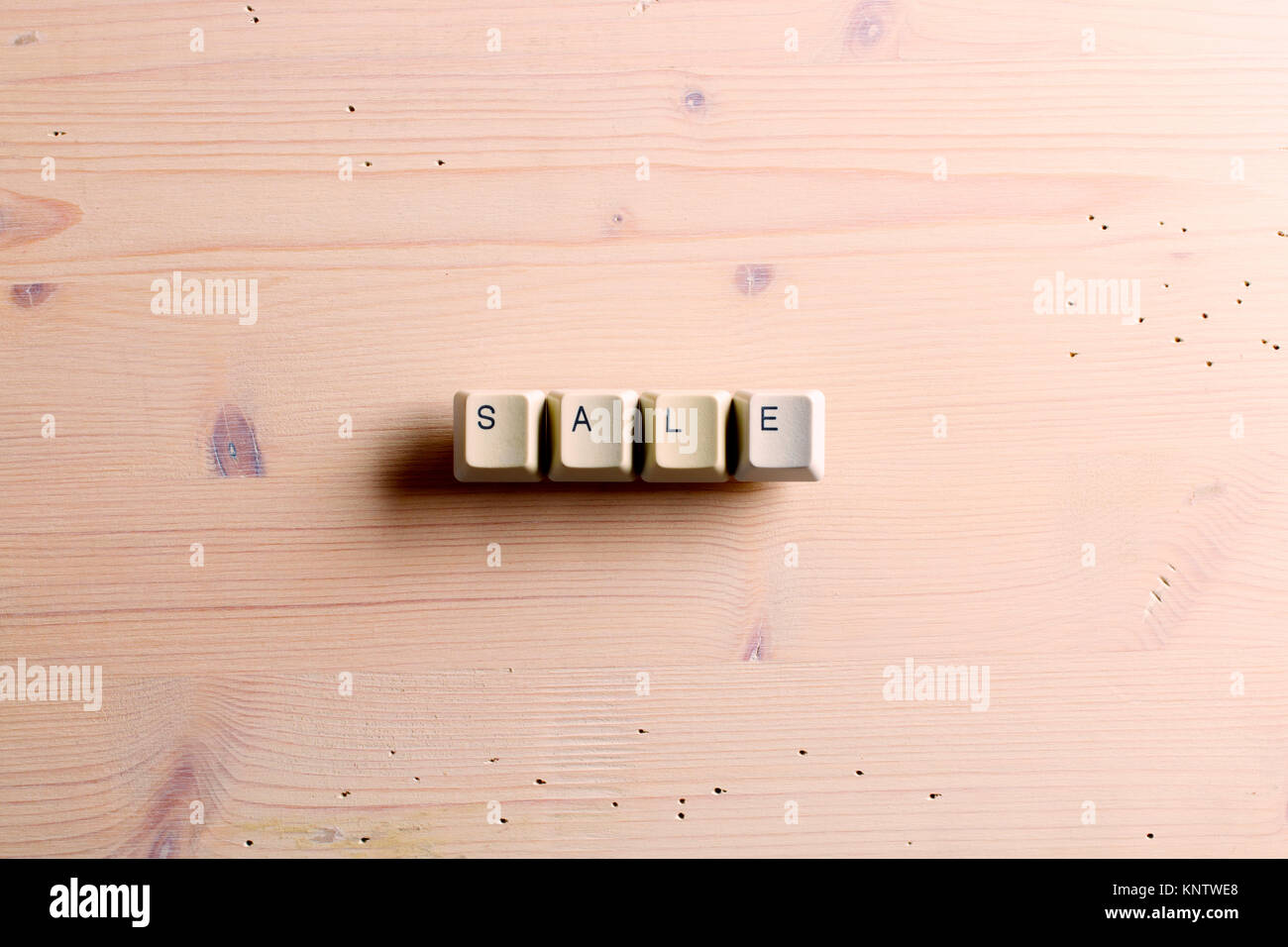 Sale word concept. Flat lay view from above on the table with computer keyboard keys buttons on ...