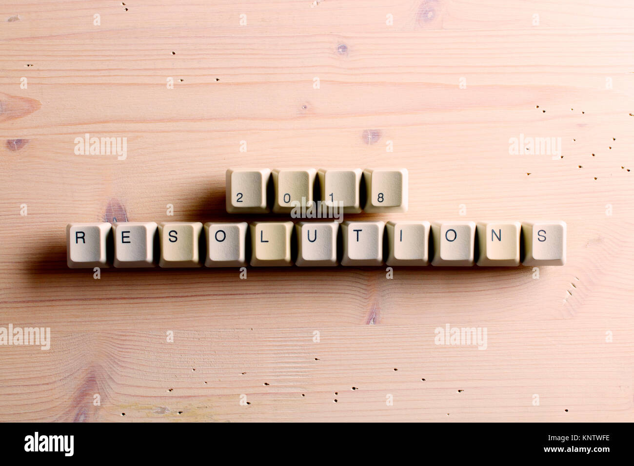 Resolutions 2018. Flat lay view from above on the table with computer keyboard keys buttons on a ...