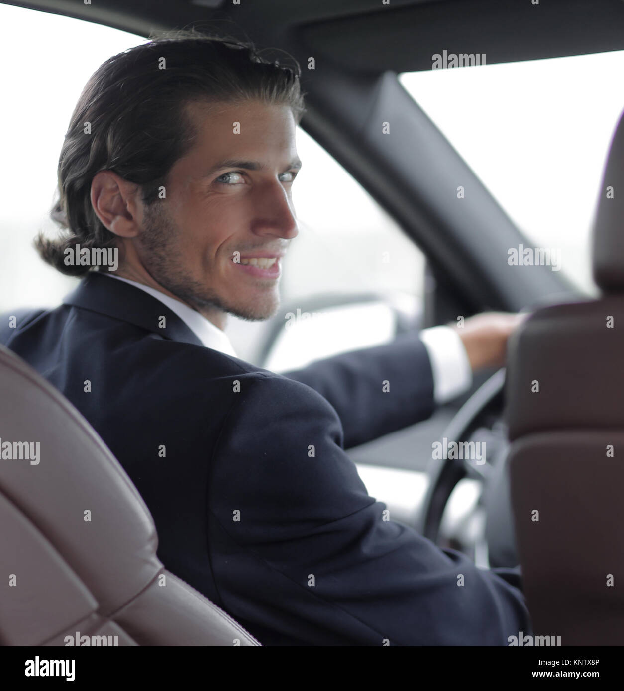 man sitting behind the wheel of a car Stock Photo - Alamy