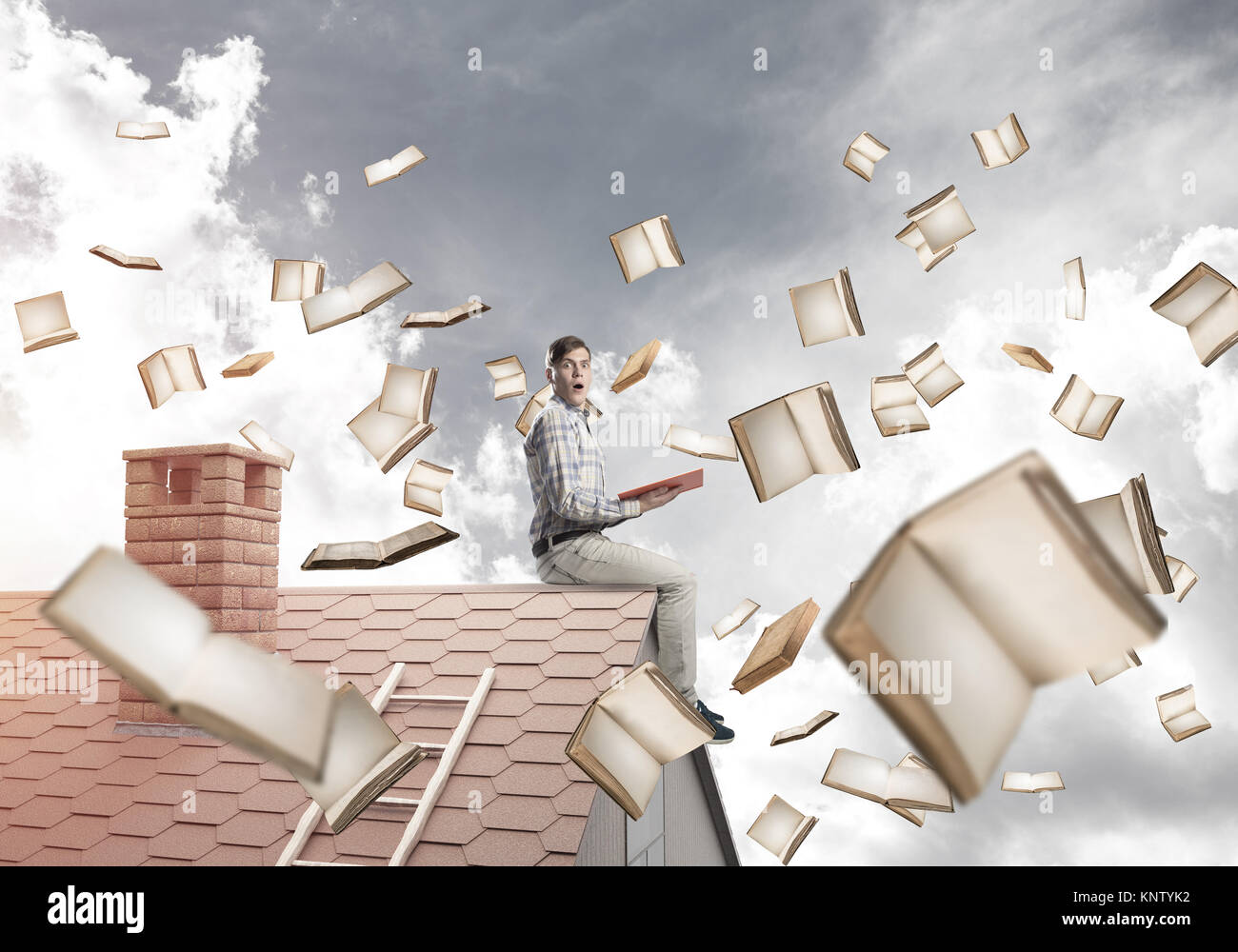 Man reading book and many of them flying in air Stock Photo - Alamy