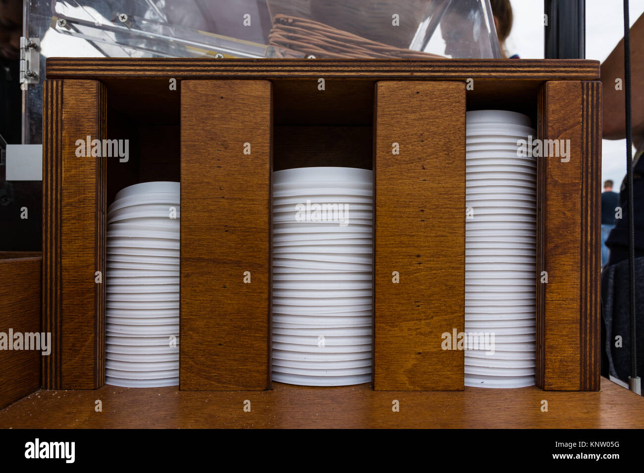 Stacked Coffee Lids Holder Increasing Pattern Stock Photo - Alamy
