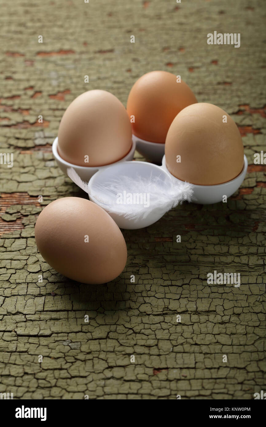 Fresh raw bio eggs on wood, food closeup Stock Photo - Alamy