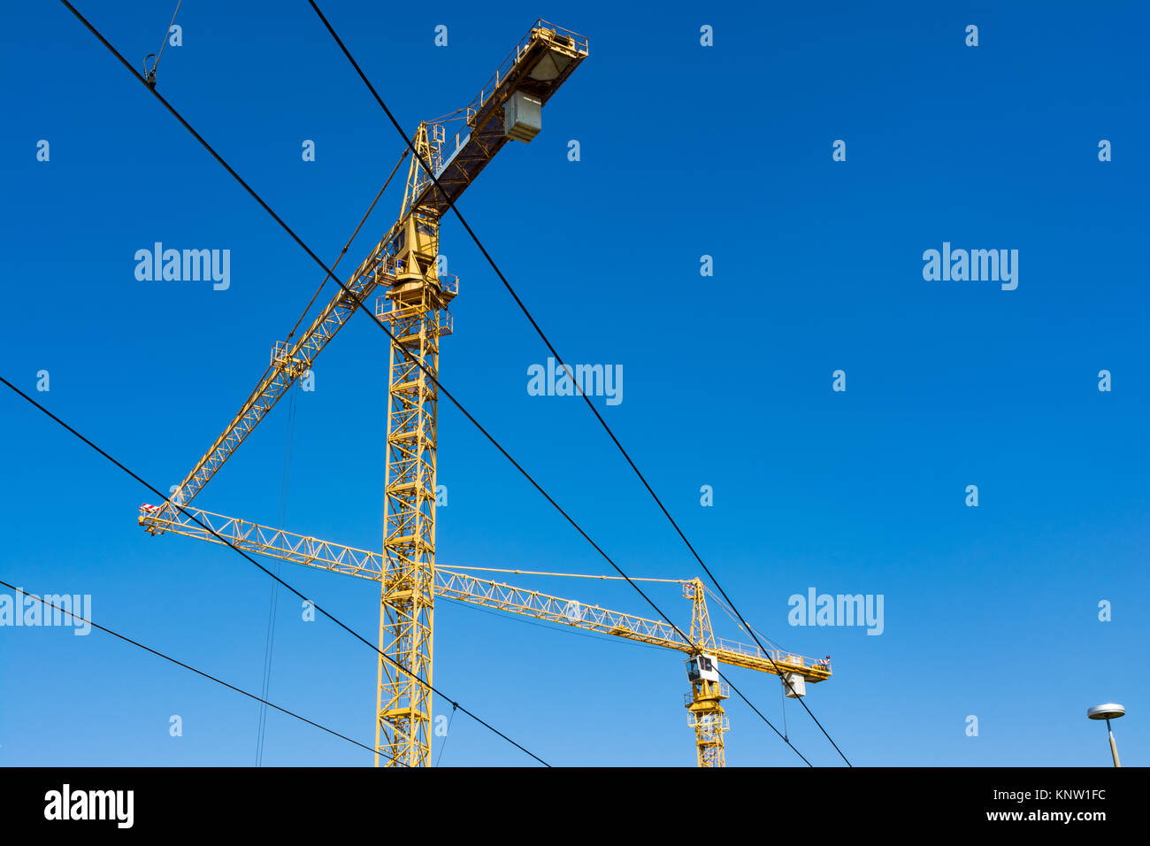 Two Cranes Pointed Toward Each Other Triangle Construction Stock Photo ...