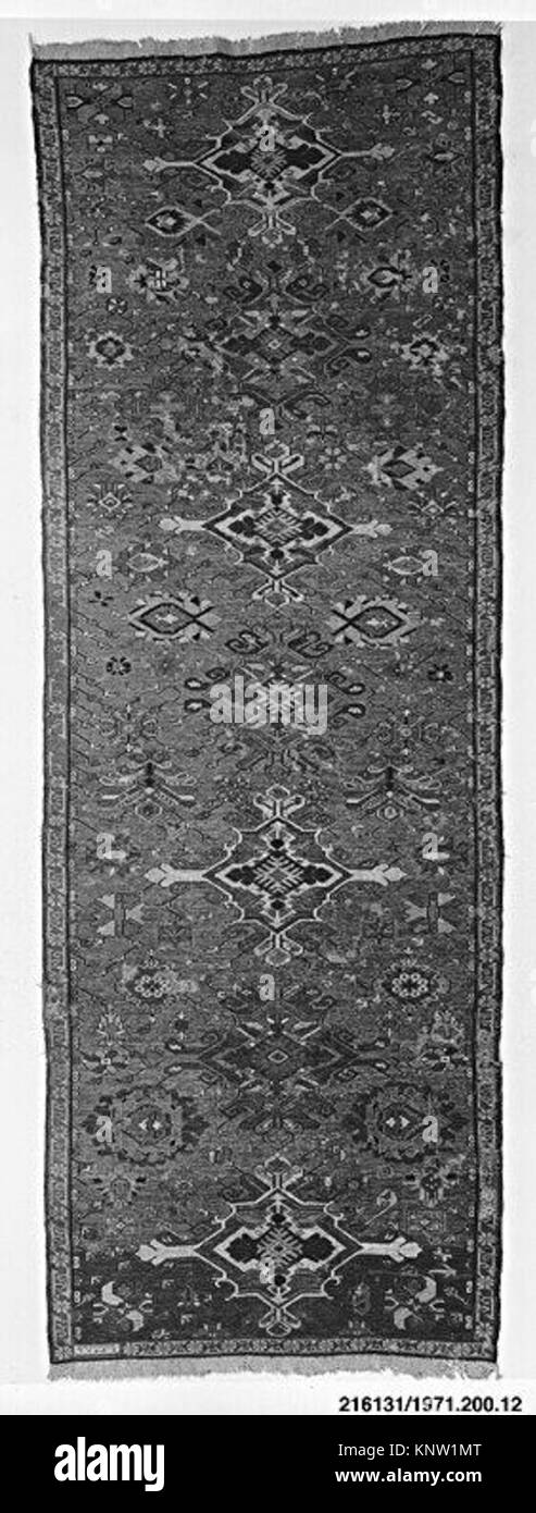A woven carpet showing decorative patterns, color schemes, and textile ...