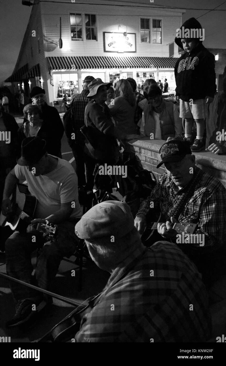 Monochrome photo of musicians playing outside in the street at the ...