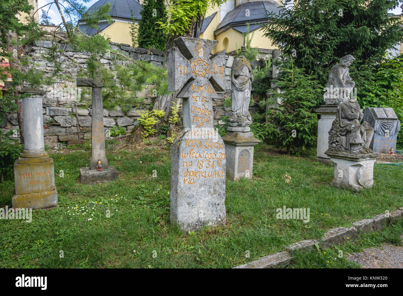 Old Polish graves on a cemetery next to Catholic Cathedral of Saints ...