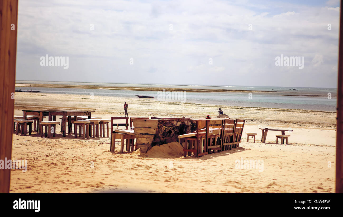 Wooden table and chairs on the beach Stock Photo - Alamy