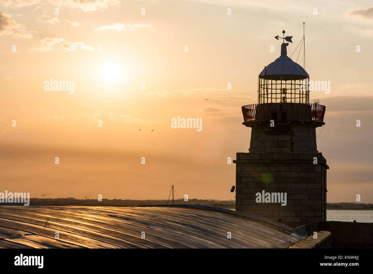 Warm Orange Sunset Sky over Howth Lighthouse Tower Ireland Stock Photo ...