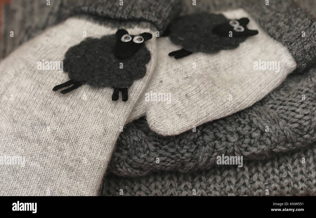 Knitted details of warm clothes sweater and gloves Stock Photo - Alamy