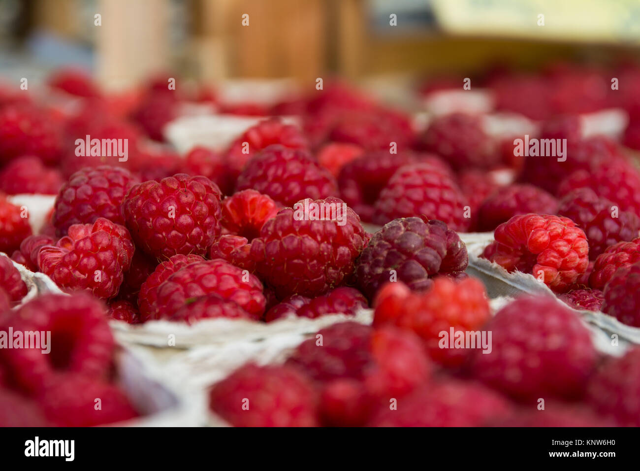 Baskets of Raspberries Macro at Local Food Market Stock Photo - Alamy