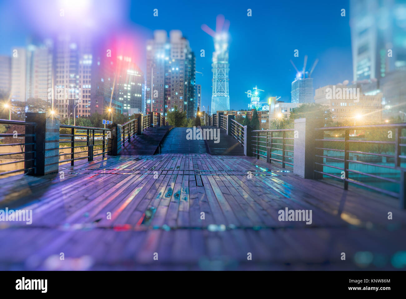 footbridge with cityscape in background at night in Beijing,China Stock ...