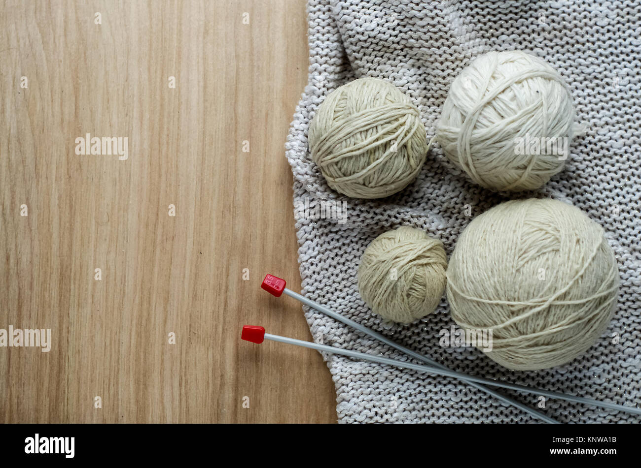 Balls of woolen yarn for knitting on the table Stock Photo - Alamy