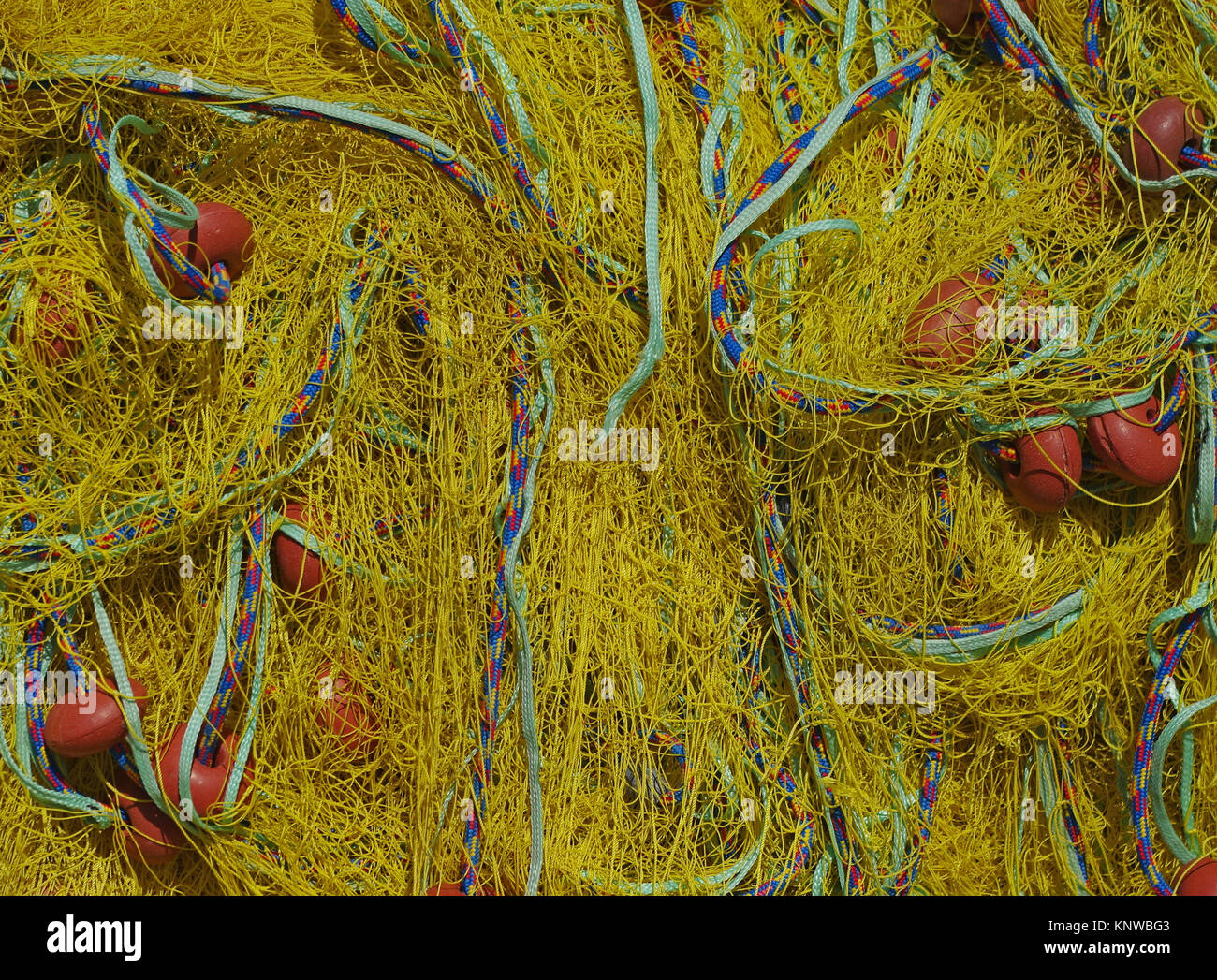 Bright yellow fishing net in a greek harbour Stock Photo - Alamy