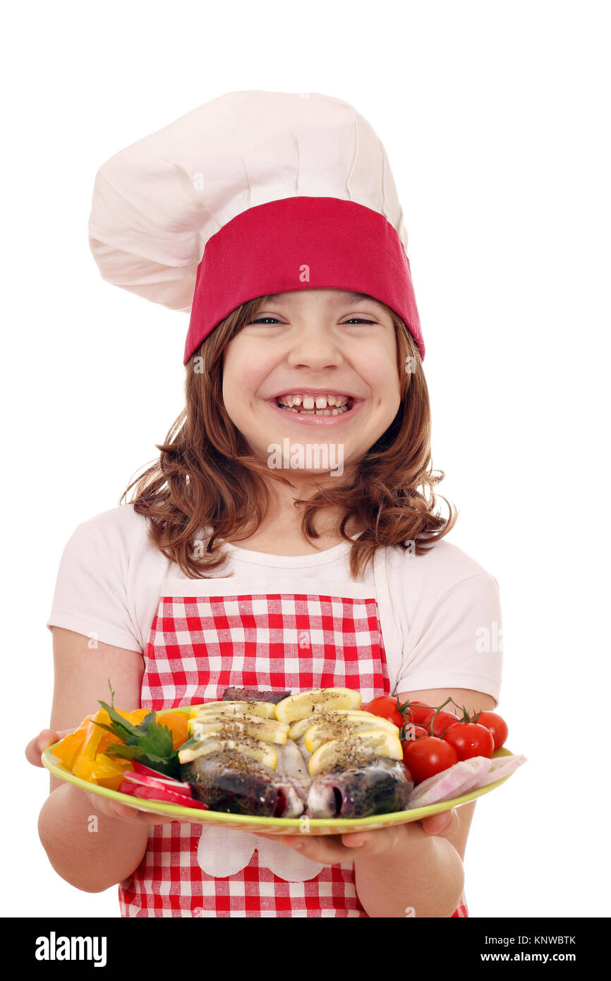 happy little girl cook with trout fish on plate Stock Photo - Alamy