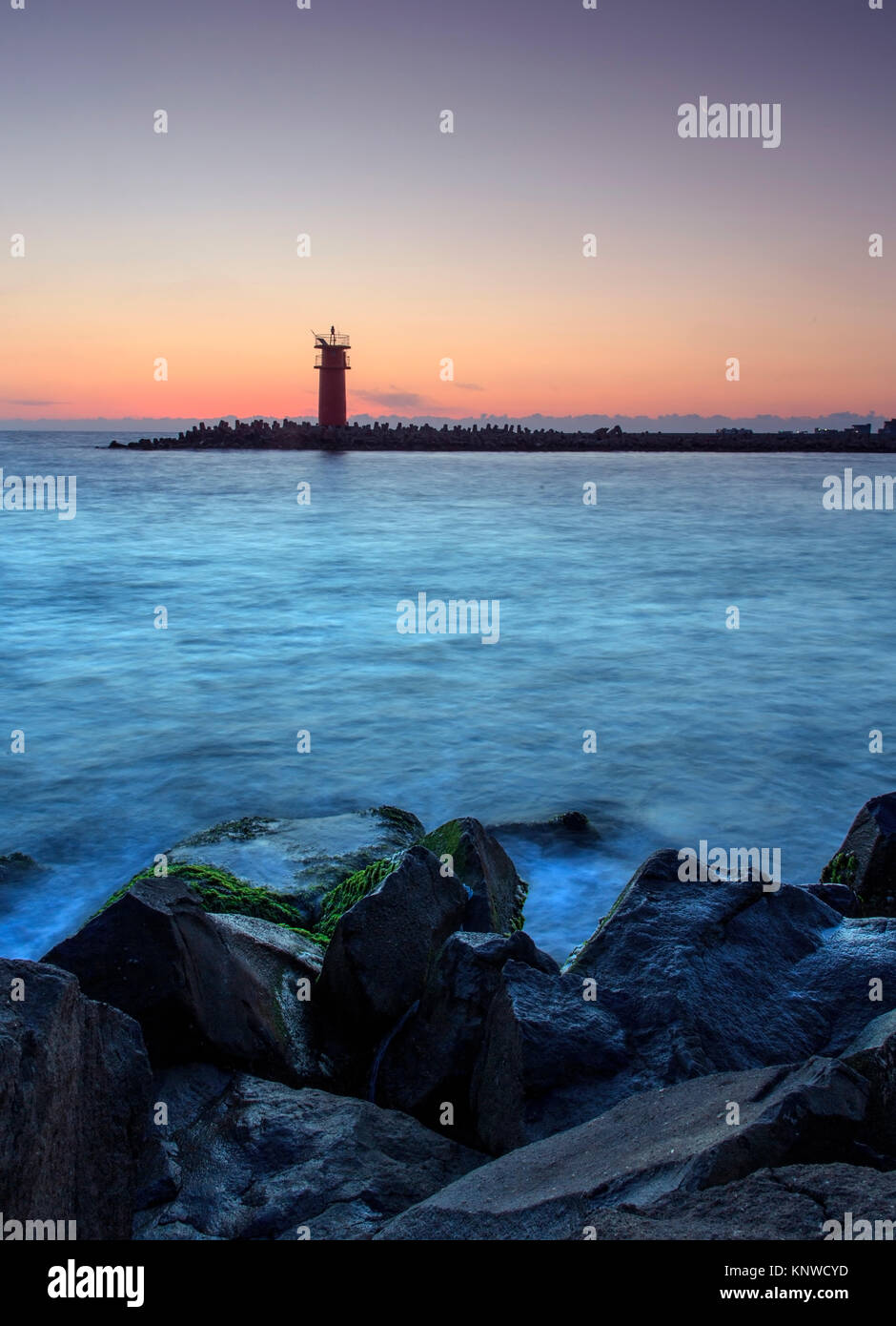 Beautiful seascape with lighthouse at the sunrise Stock Photo - Alamy