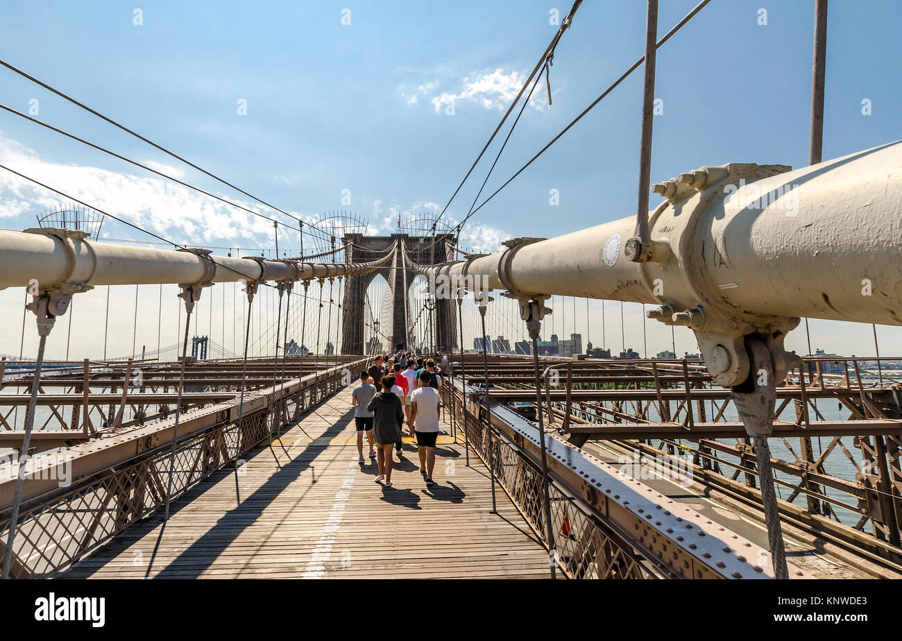 NEW YORK - JULY 17: People walk on Brookly Bridgre in New York City on ...