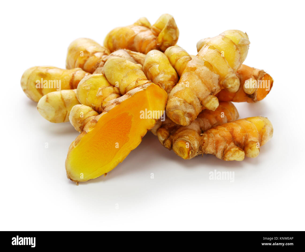 fresh whole turmeric on white background Stock Photo - Alamy