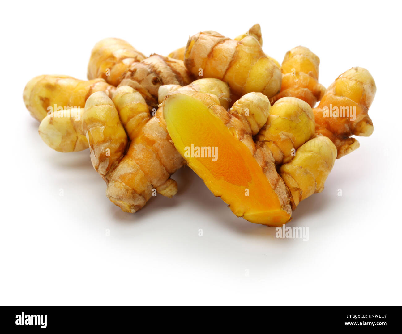 fresh whole turmeric on white background Stock Photo - Alamy