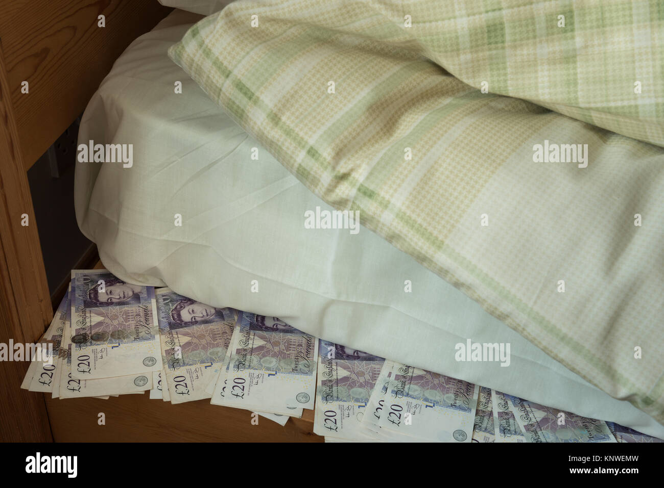 A ready supply of stashed cash money banknotes under the bed mattress ...