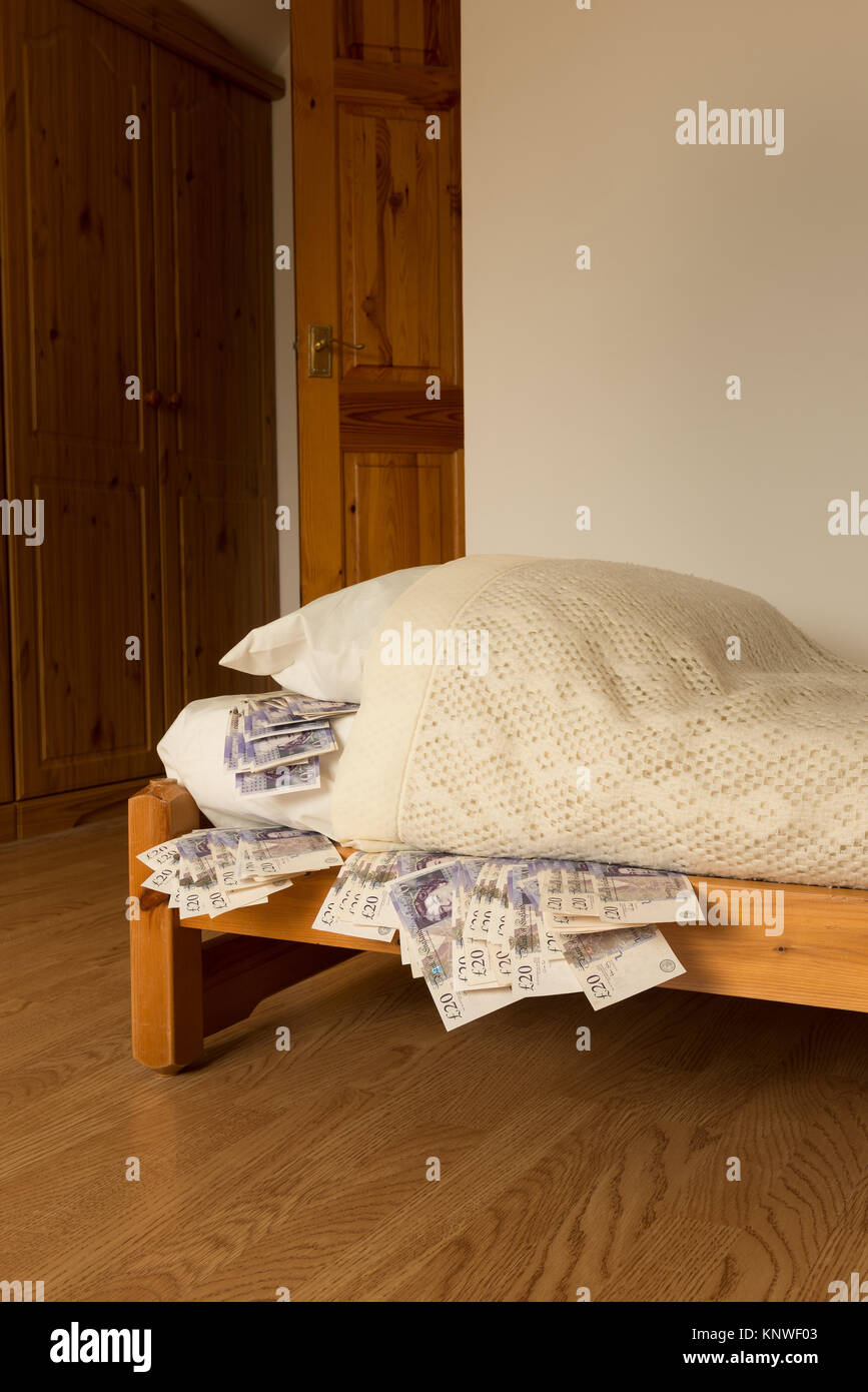 A ready supply of stashed cash money banknotes under the bed mattress ...