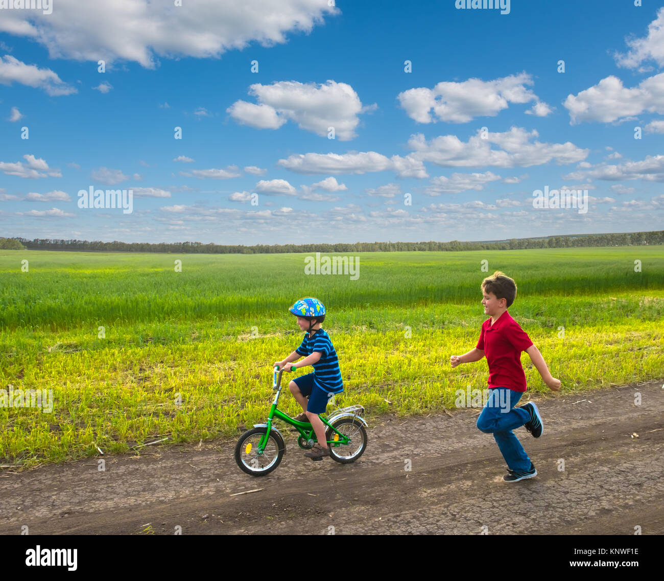 children on bicycle in rural landscape Stock Photo - Alamy