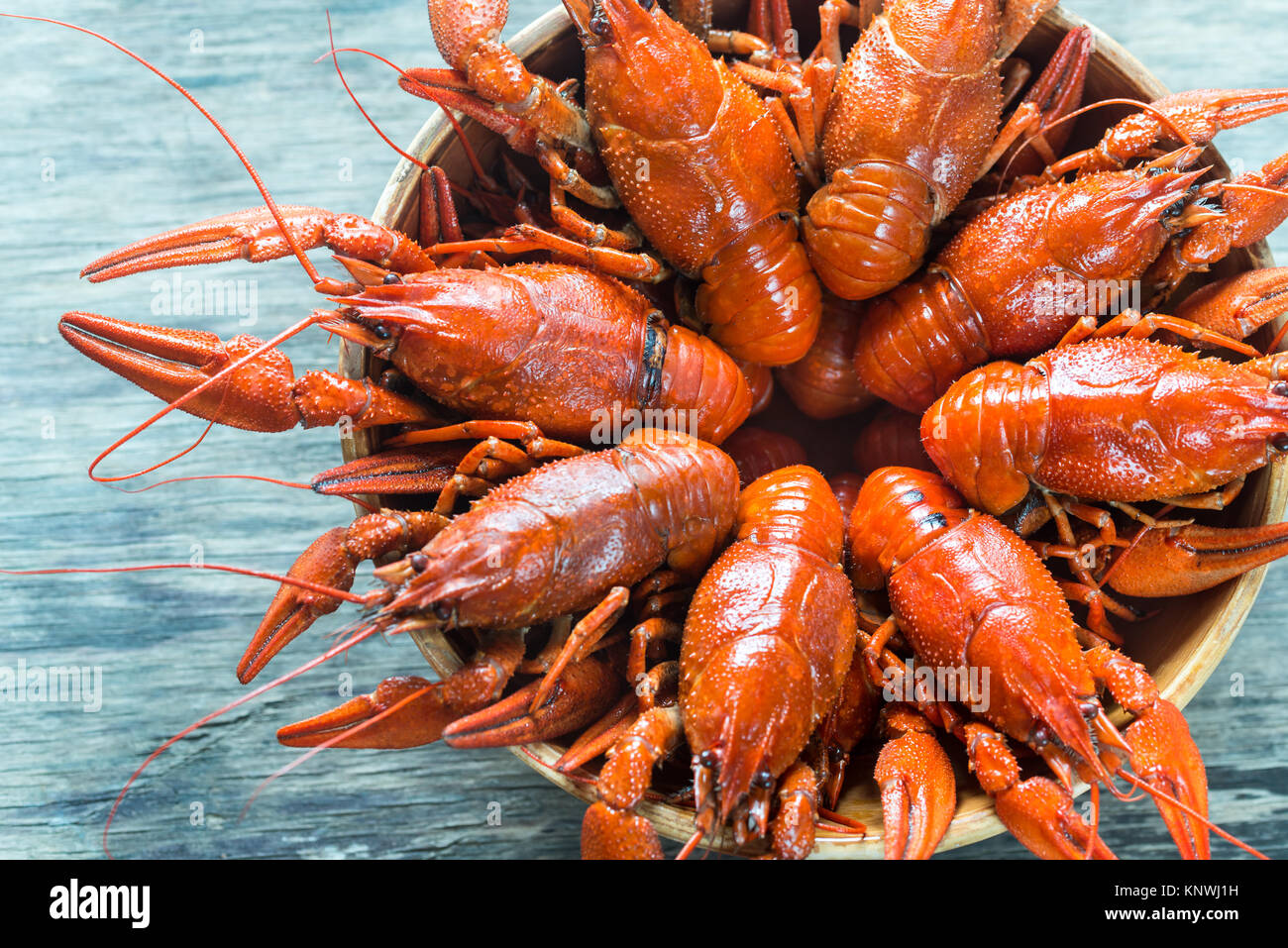 Bowl of boiled crayfish on the wooden table Stock Photo - Alamy