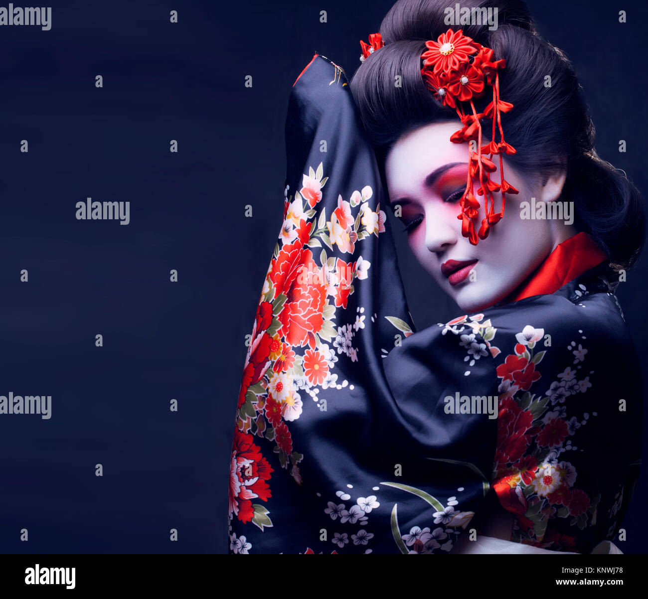 young pretty real geisha in kimono with sakura and decoration Stock ...