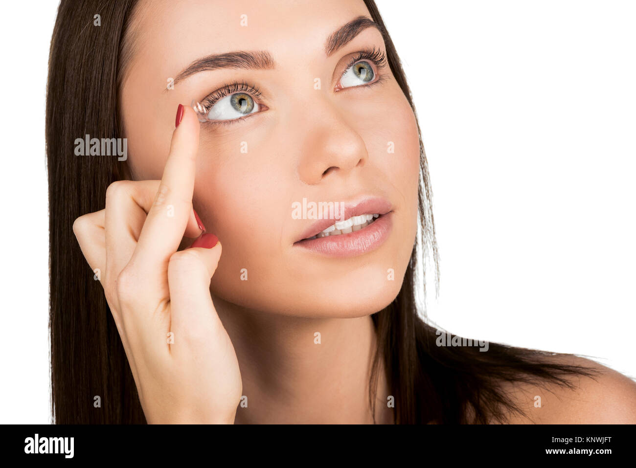 woman applying contact lens Stock Photo - Alamy