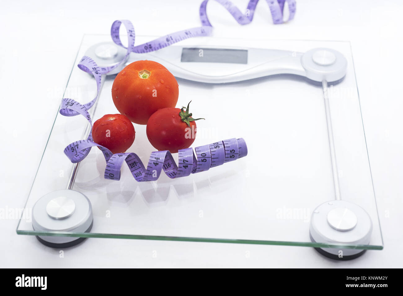 Abstract photo on a diet theme. Scales on a white background Stock ...