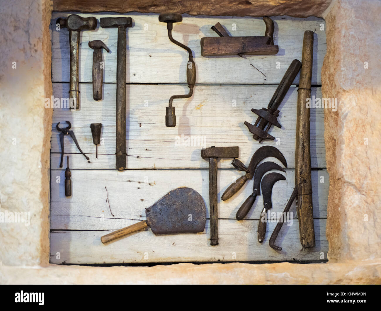 Old tools collection on wooden wall. Abstract photo Stock Photo - Alamy
