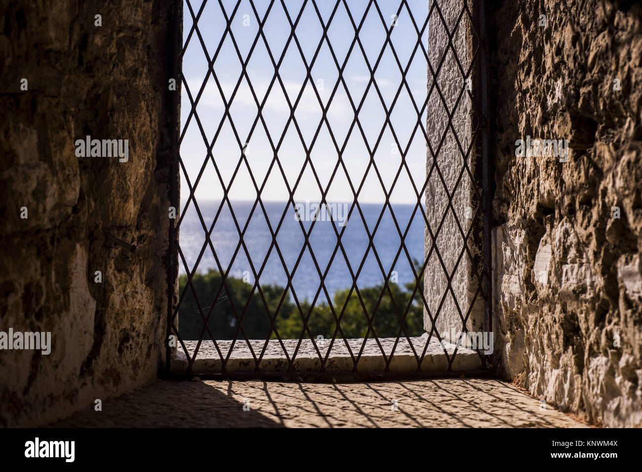 Window in old castle with view to blue sea Stock Photo - Alamy