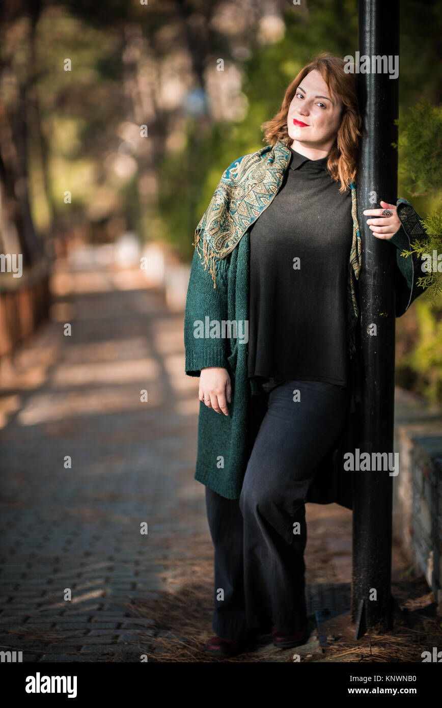 Woman in the park, looking at camera, full body shot Stock Photo - Alamy
