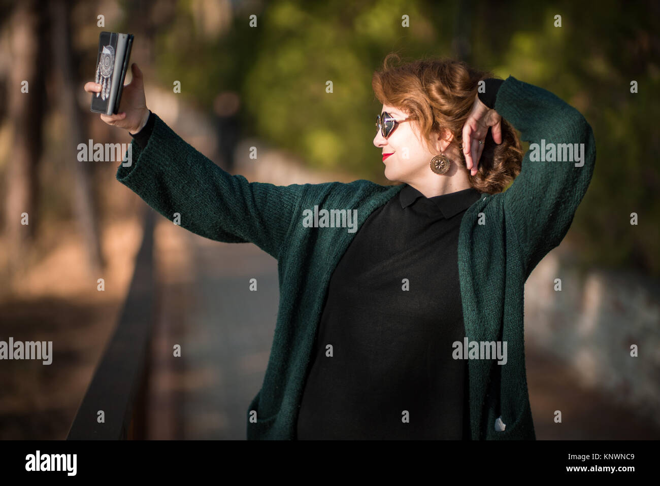 Taking Selfie Snapshot with Attitude, Woman with Smartphone at the Park ...