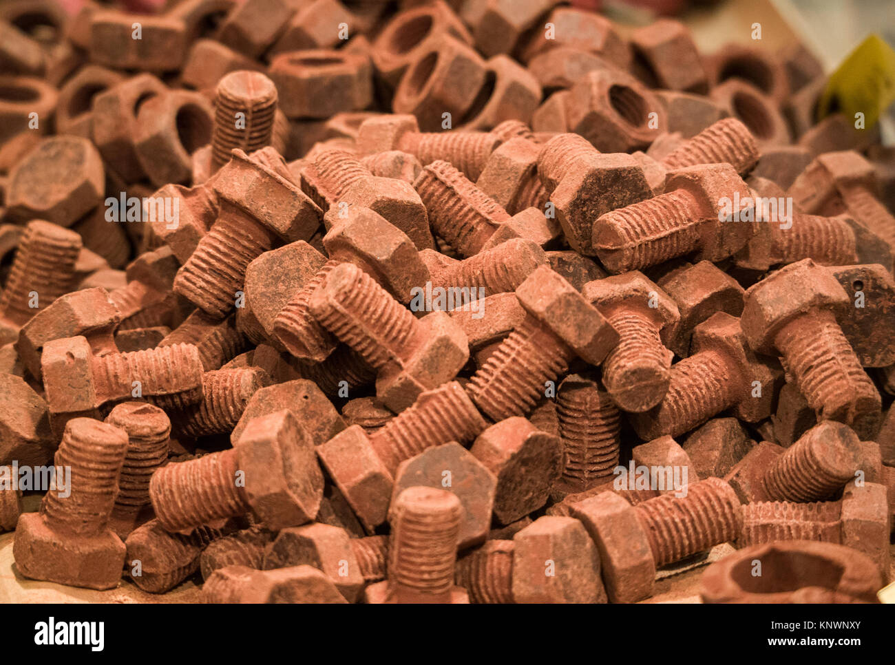 reproduction in milk chocolate, screws and bolts Stock Photo - Alamy