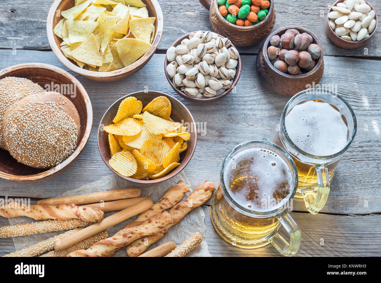 Two glasses of beer with appetizers Stock Photo - Alamy
