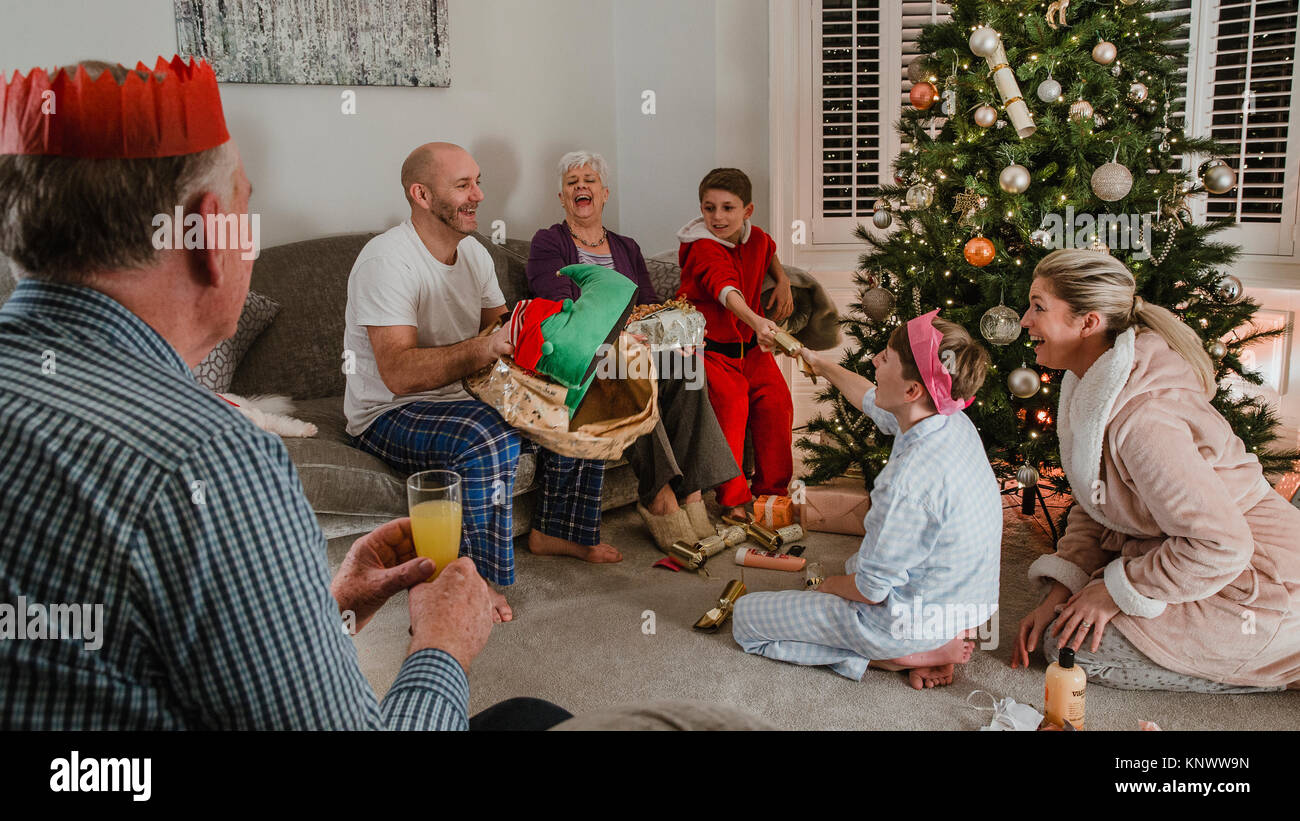 Family three children sitting together hi-res stock photography and ...