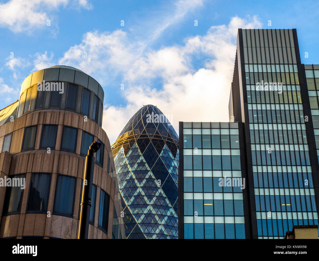 The Gherkin building and the Towergate building (left) in the city of ...