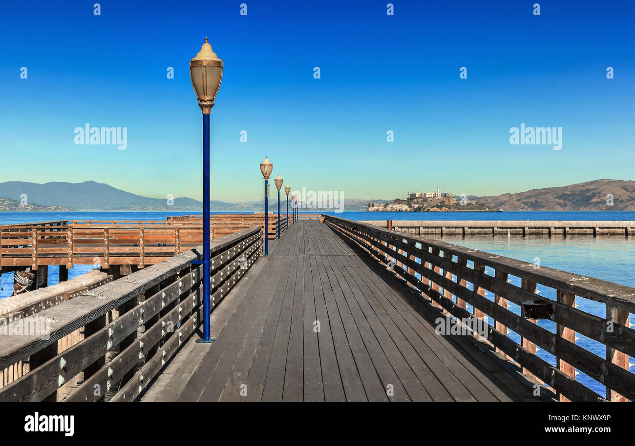 Sunny day long wood pier hi-res stock photography and images - Alamy