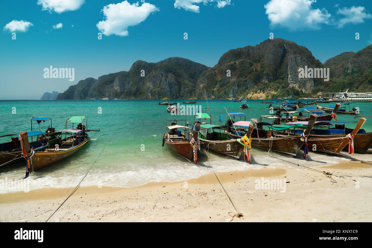Tonsai Beach bay view with many traditional longtail boats parking and ...