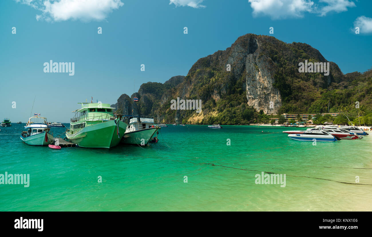 Tonsai Beach bay view with many traditional longtail boats parking and ...