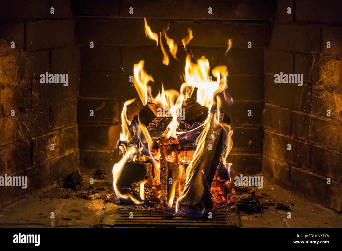 fire in brick fireplace Stock Photo - Alamy